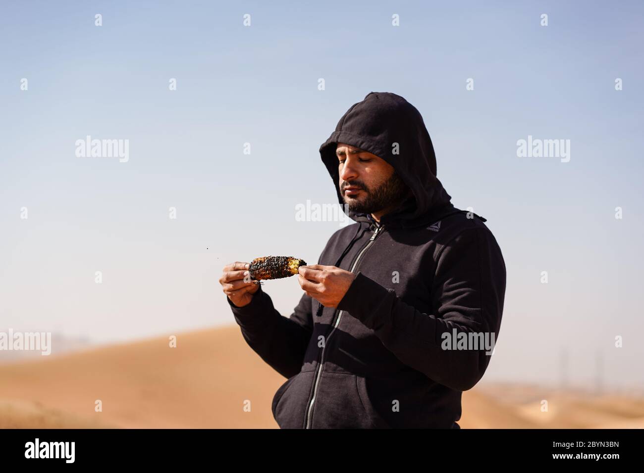 Abu Dhabi / United Arab Emirates - February 5, 2020: Arab man eats ...