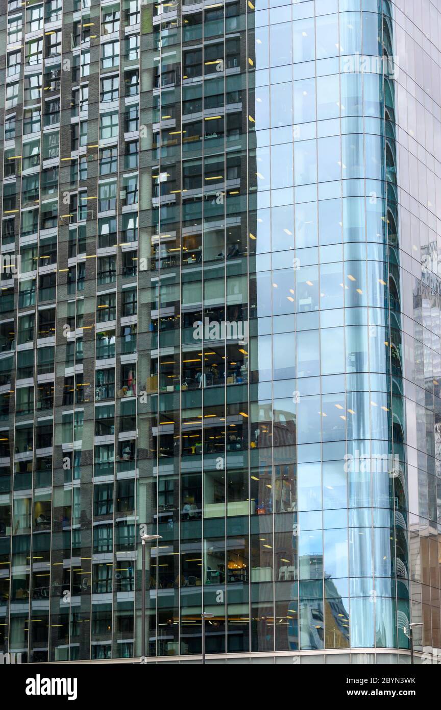 LONDON - SEPTEMBER 23, 2019: Offices seen through the glass facade of Aldgate Tower on ...