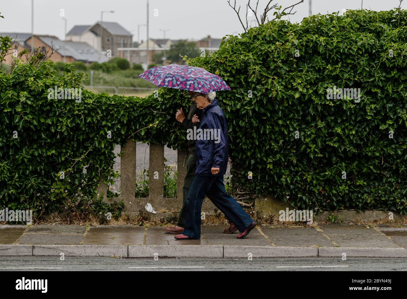 PORTHCAWL, WALES - 10 JUNE 2020 - Local residents seen walking in the ...