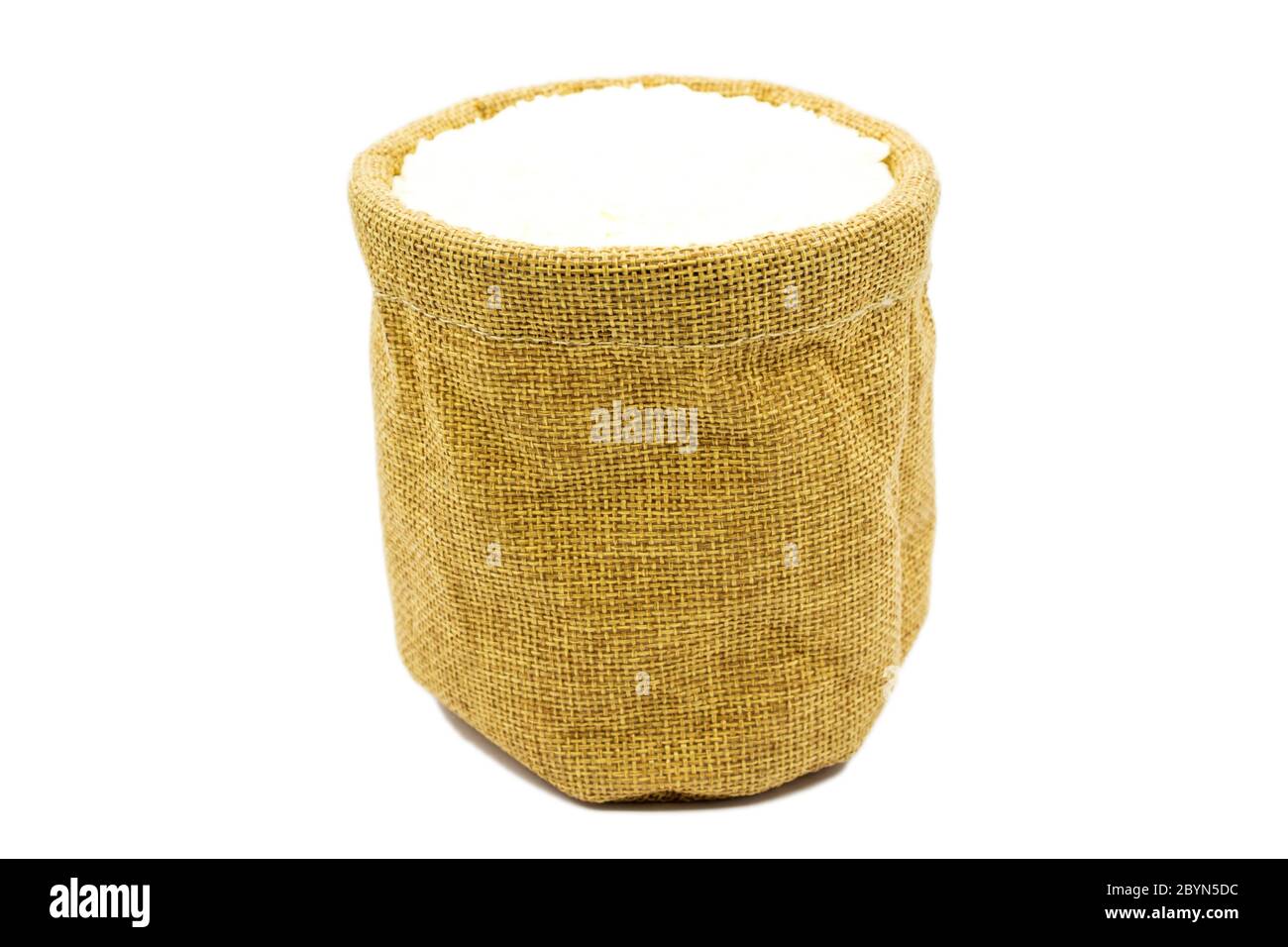 thai raw rice on sack isolated white background Stock Photo - Alamy