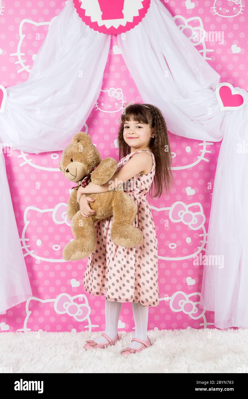 Little Girl Hugging Teddy Bear Stock Photo - Alamy