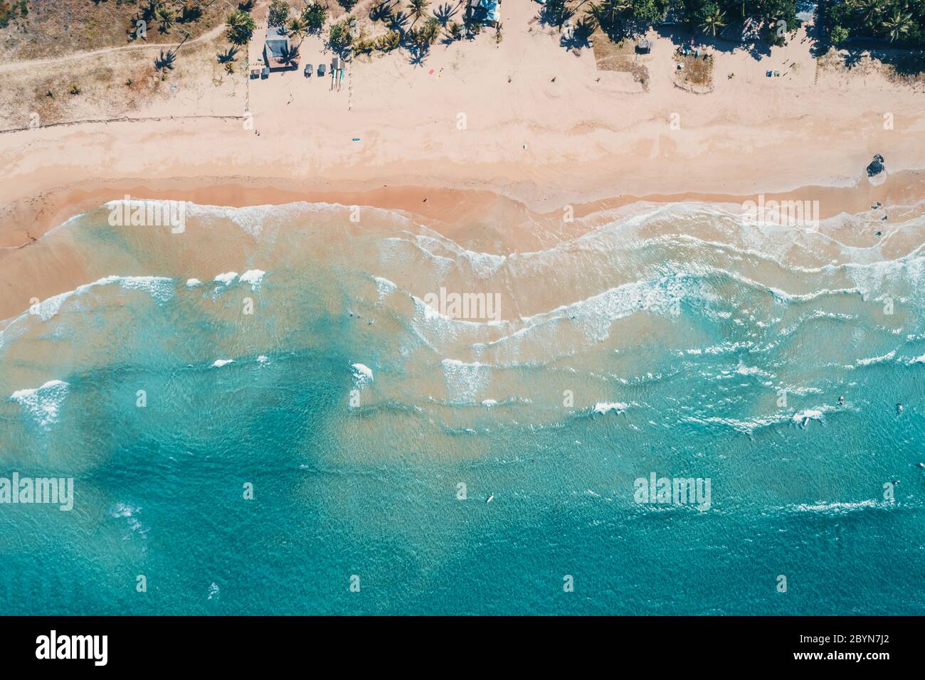 Aerial view to tropical sandy beach and blue ocean. Top view of ocean ...