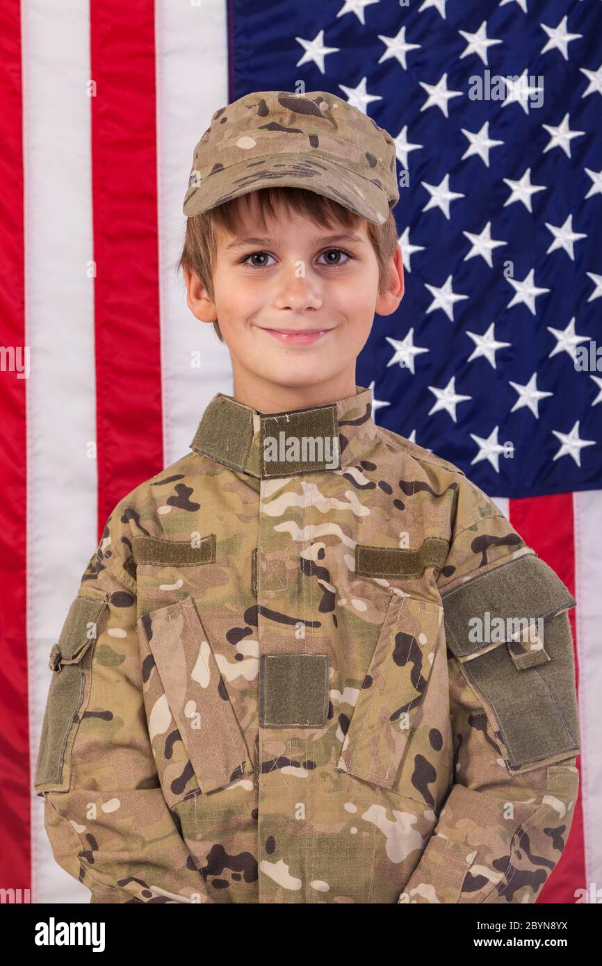 Young boy dressed like a soldier with American flag Stock Photo - Alamy