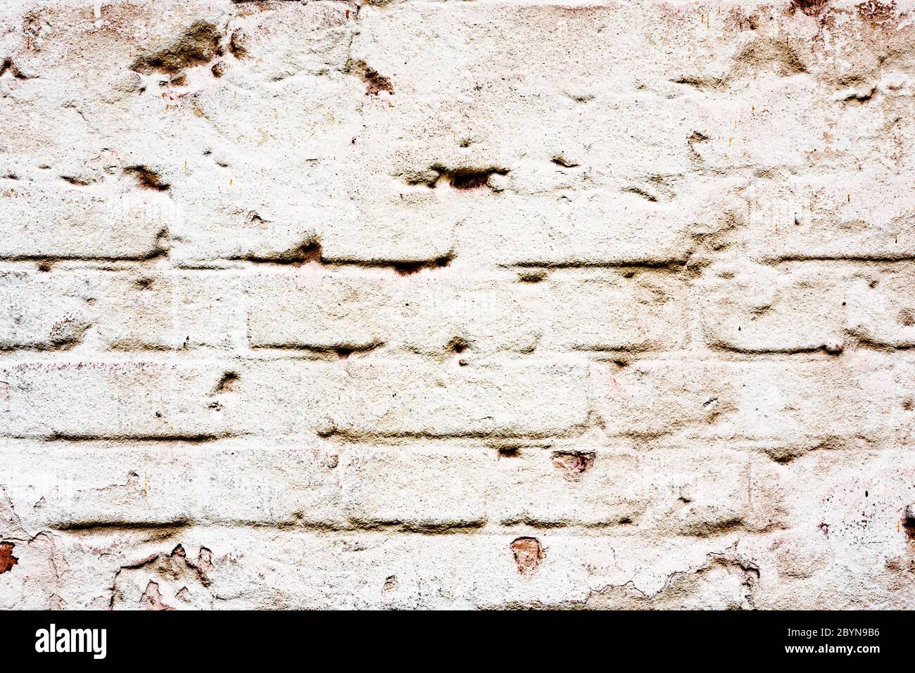 Weathered texture of stained old green and white brick wall background ...