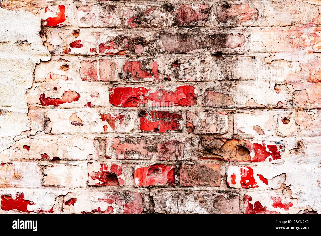 Weathered texture of stained old orange and white brick wall background ...