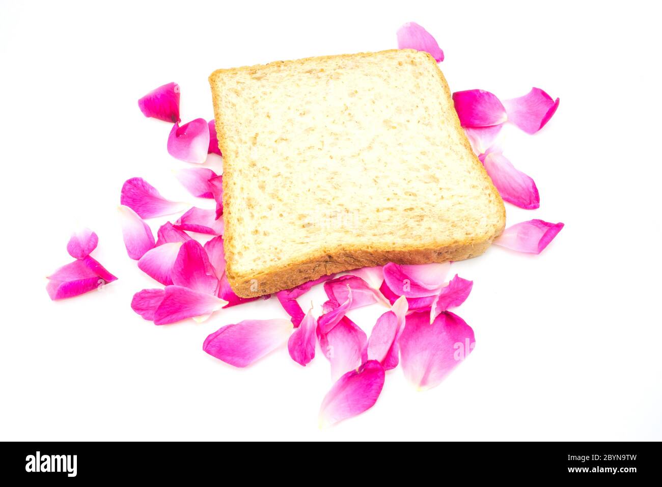 rose with whole wheat bread isolated on white background Stock Photo ...
