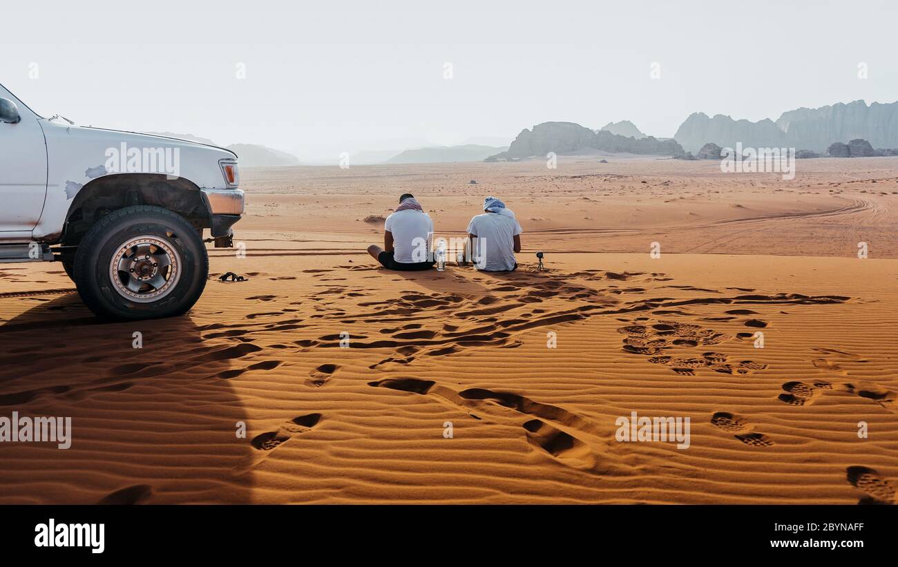 Off-road vehicle driving in desert. Driving a 4-wheel drive SUV on the ...