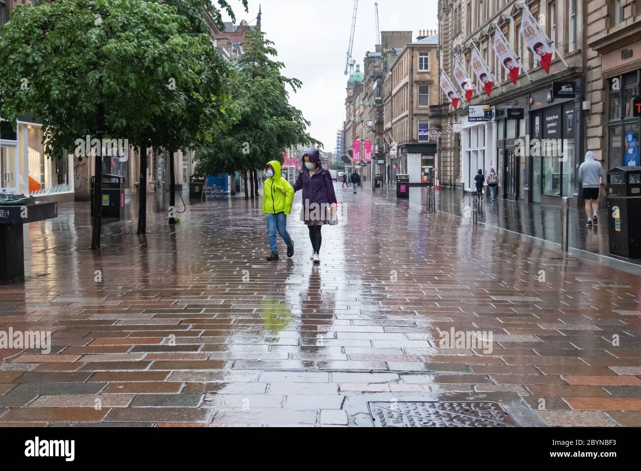 Glasgow, Scotland, UK. 10th June, 2020. UK Weather. Pedestrians in ...