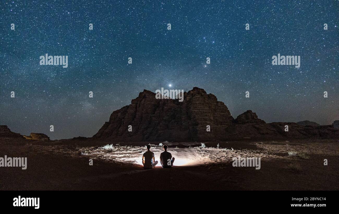 Man lighting up the White Domes in Wadi-Rum desert, Jordan, Middle East ...