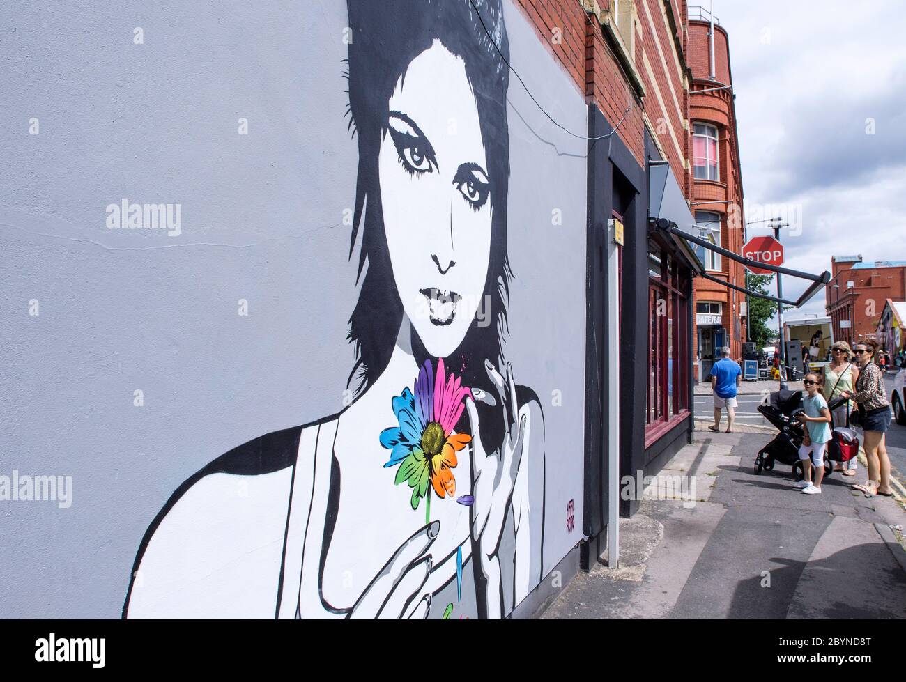 A family are pictured looking at artwork painted in Bedminster, Bristol ...