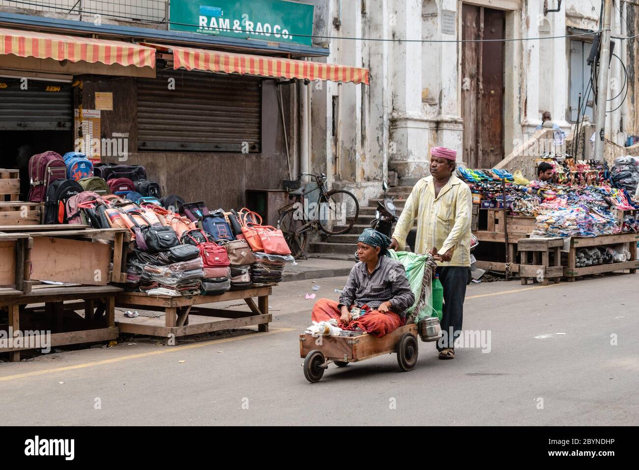 Chennai, Tamil Nadu, India - August 2018: A poor Indian man pushes a ...