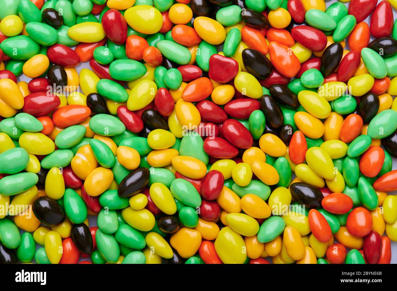 Mix of chewy colorful candy pattern background Stock Photo - Alamy