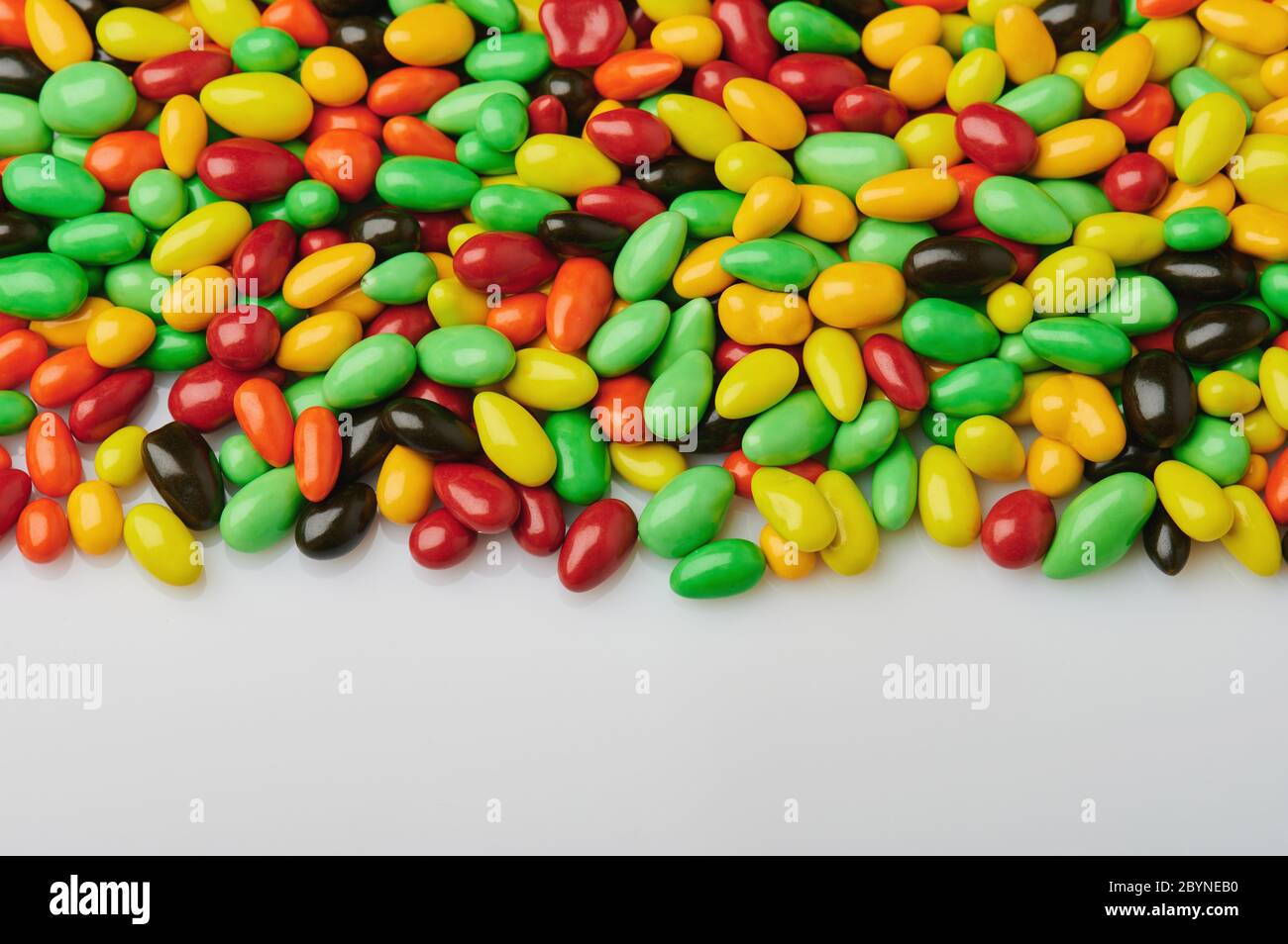 Colorful green and yellow candy with copy space Stock Photo - Alamy