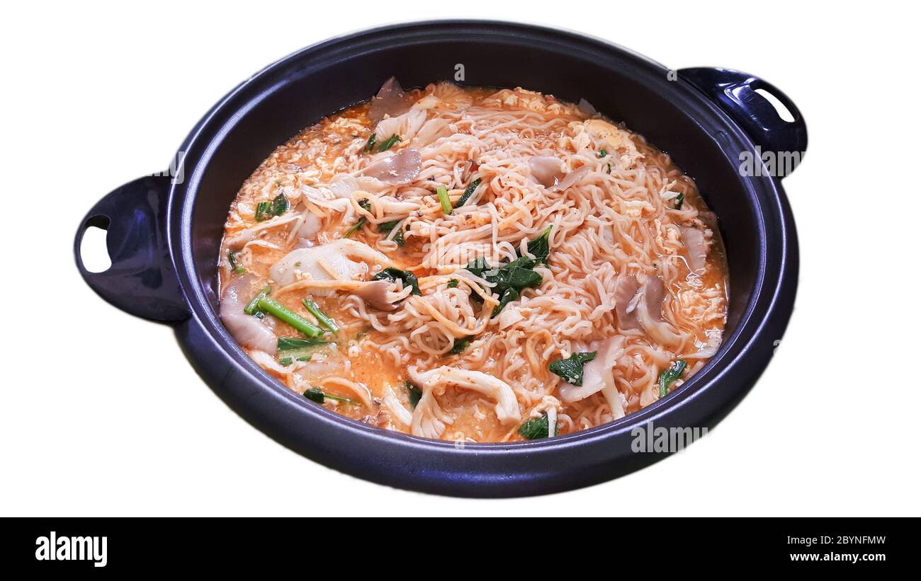 cooking instant noodles in frying pan, famous food isolated on ...