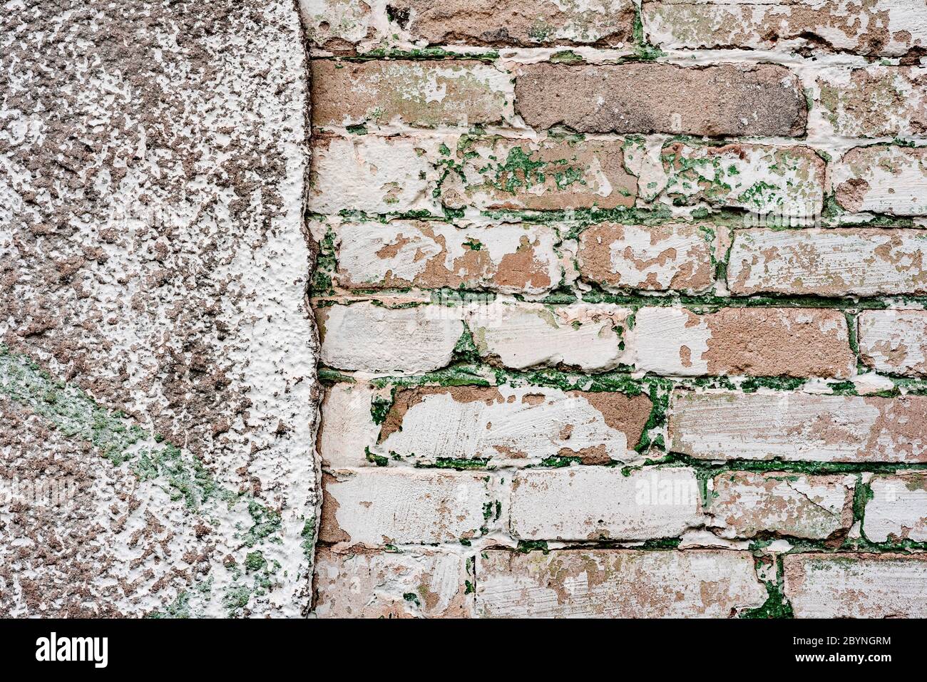 Weathered texture of stained old green and white brick wall background ...