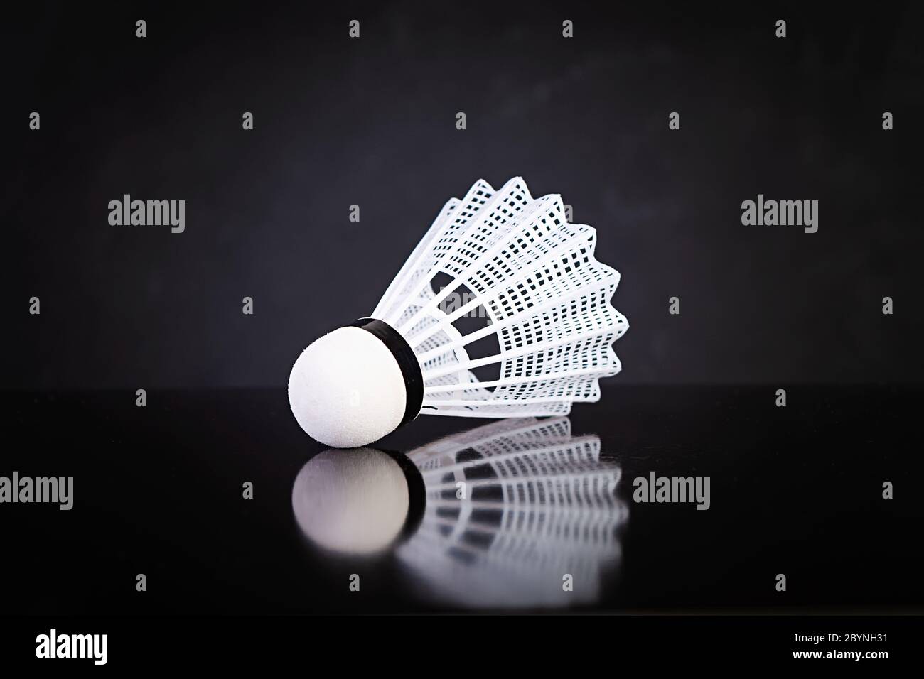 Shuttlecock for badminton isolated on dark background Stock Photo - Alamy