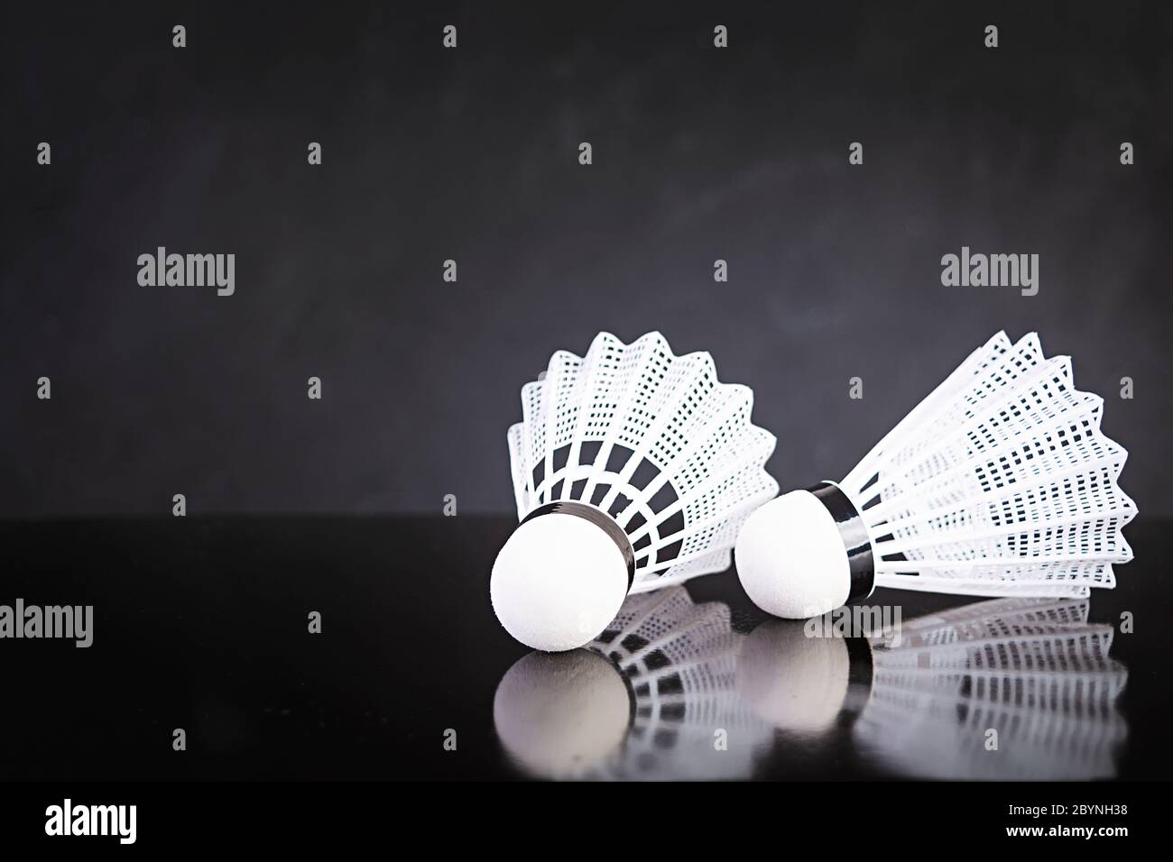 Shuttlecock for badminton isolated on dark background Stock Photo - Alamy