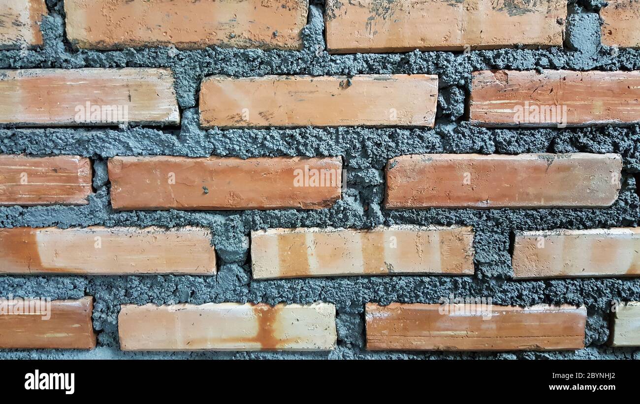 close-up wall brick cement background Stock Photo - Alamy