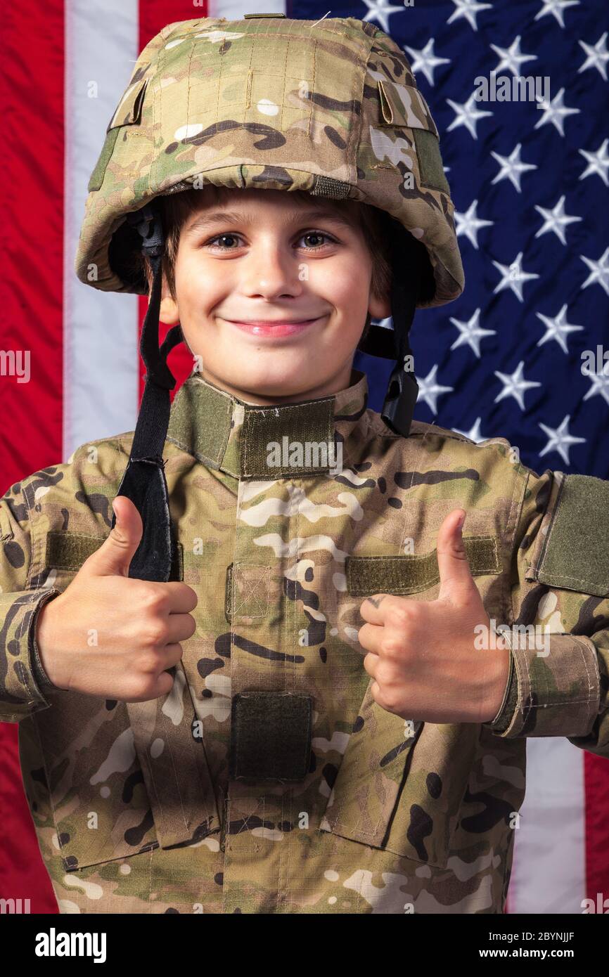 Young boy dressed like a soldier with American flag Stock Photo - Alamy