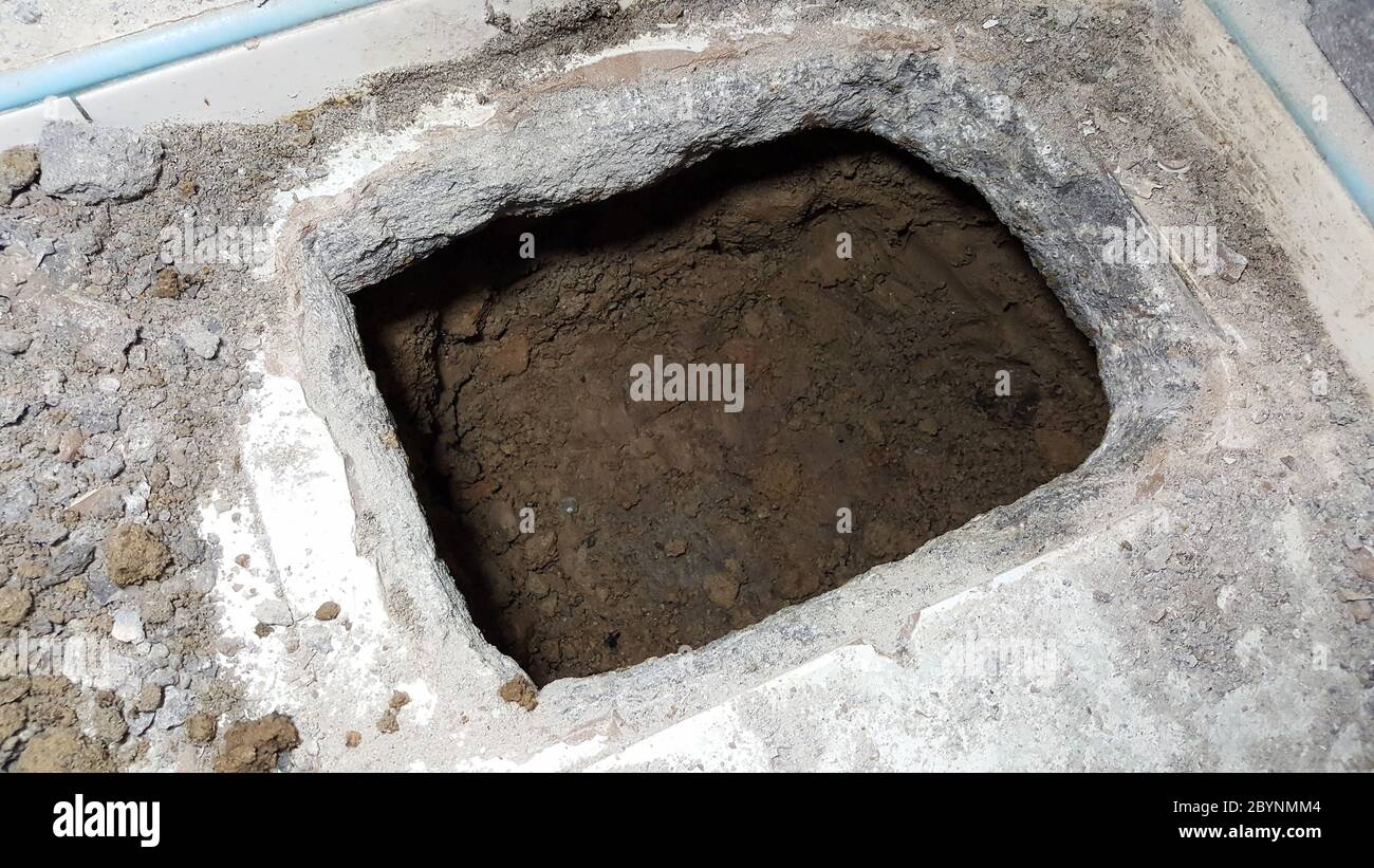 dig hole on floor house, mortar concrete interior Stock Photo - Alamy