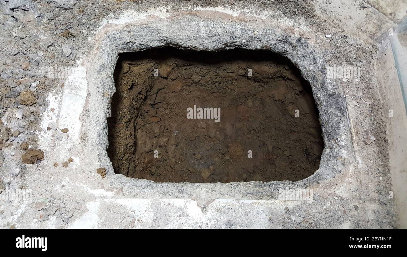 dig hole on floor house, mortar concrete interior Stock Photo - Alamy