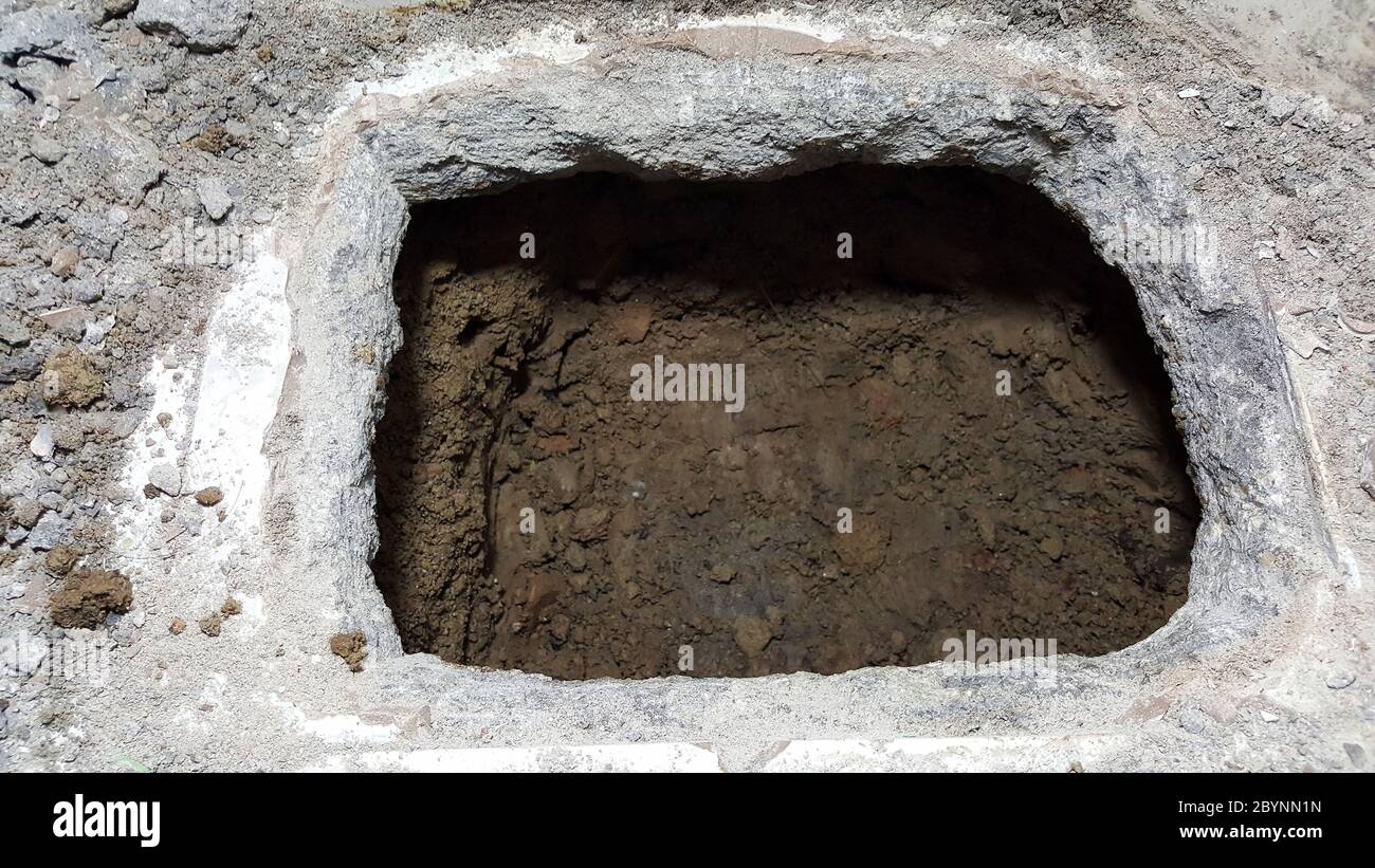 dig hole on floor house, mortar concrete interior Stock Photo - Alamy