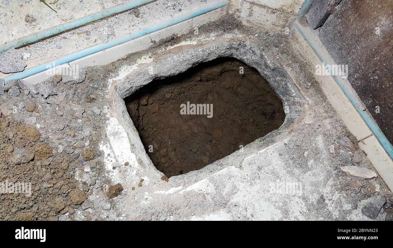 dig hole on floor house, mortar concrete interior Stock Photo - Alamy