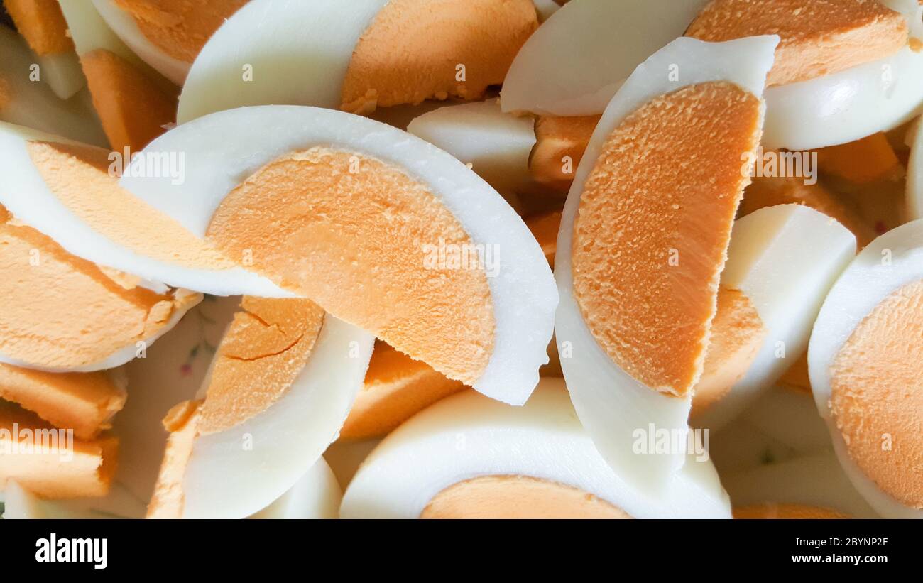 close-up boiled egg slice pieces Stock Photo - Alamy