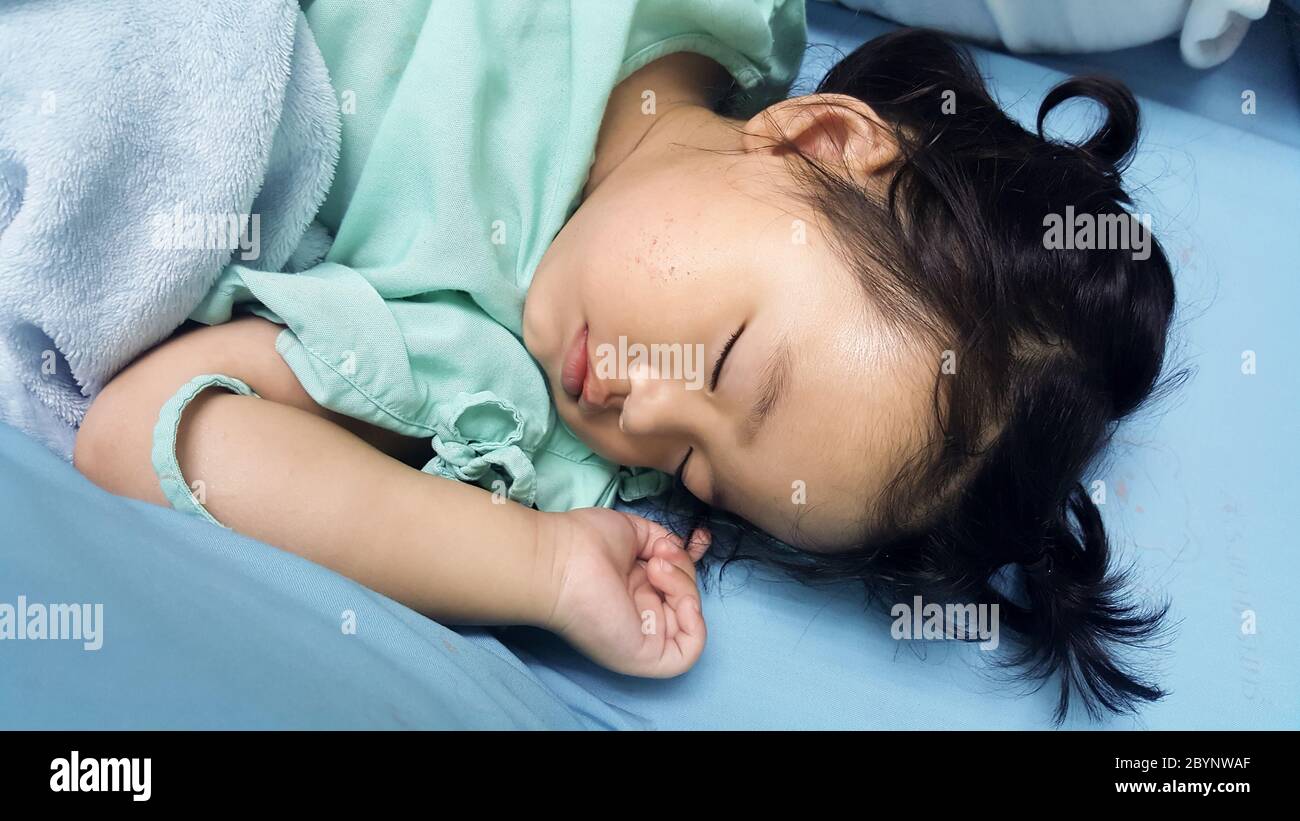 close-up sick child on hospital bed, asia Stock Photo - Alamy