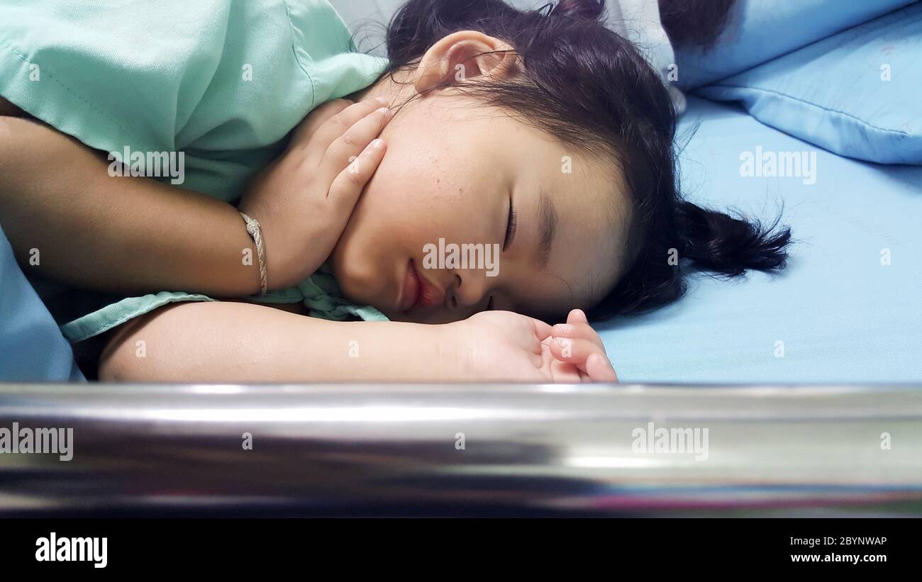 close-up sick child on hospital bed, asia Stock Photo - Alamy