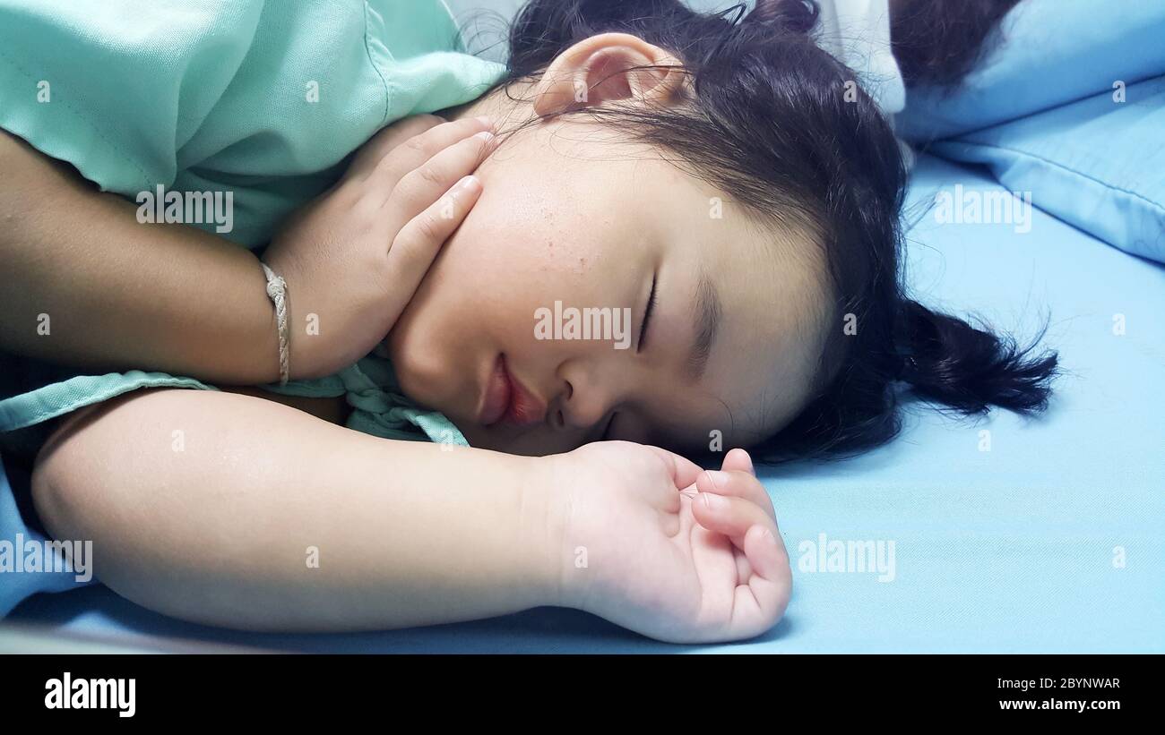 close-up sick child on hospital bed, asia Stock Photo - Alamy