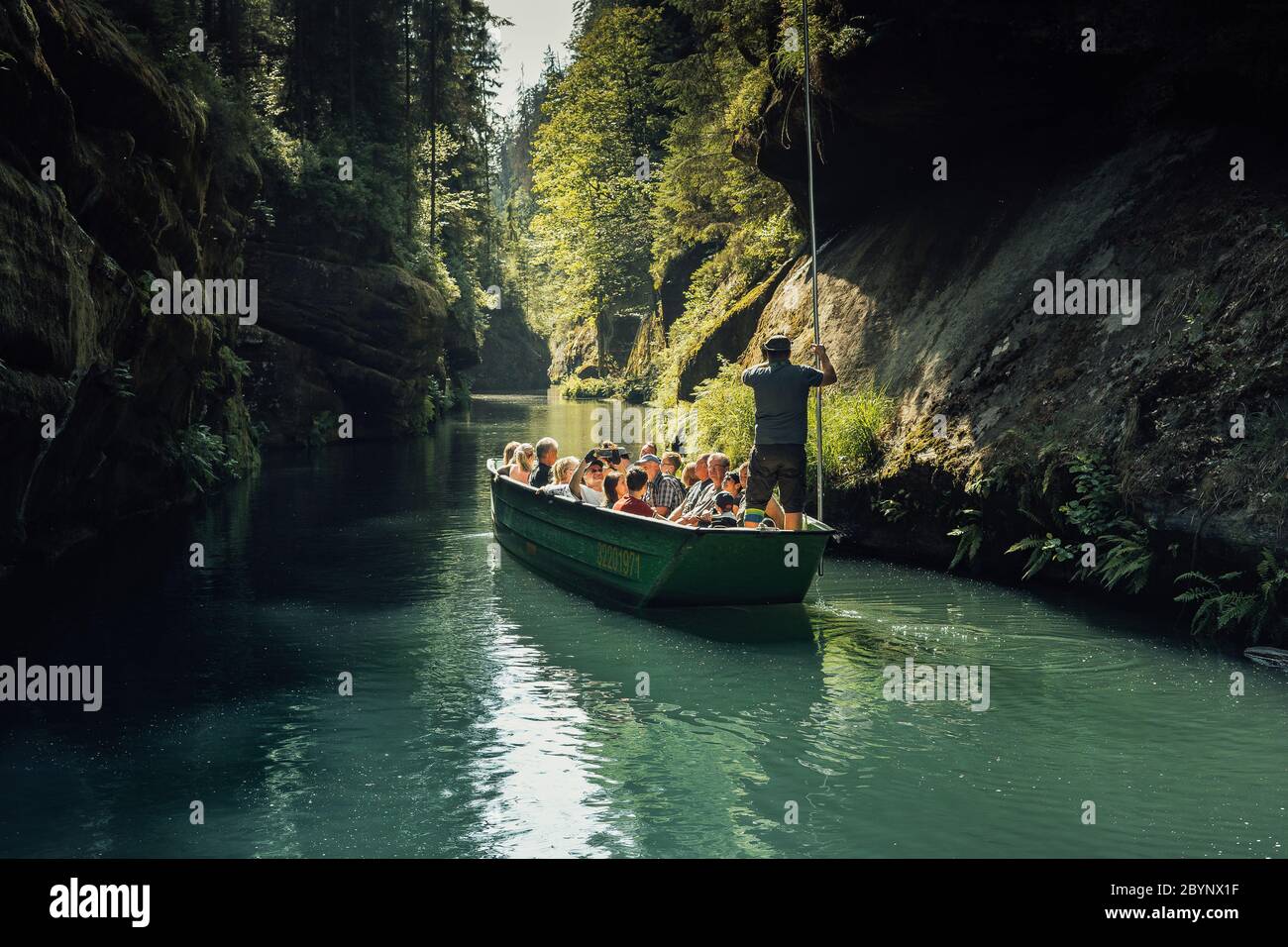 Touristic atraction on the river, people on the boat traveling around ...