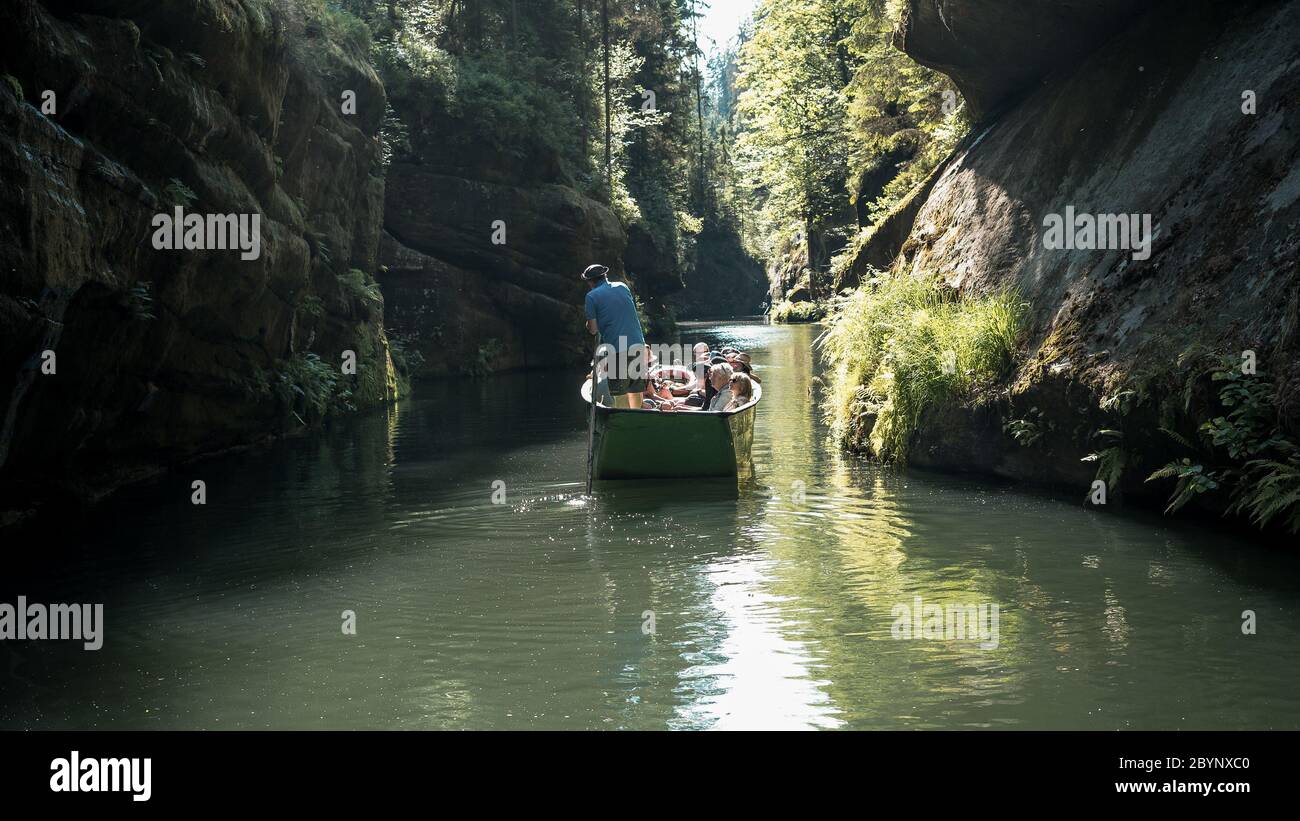 Touristic atraction on the river, people on the boat traveling around ...