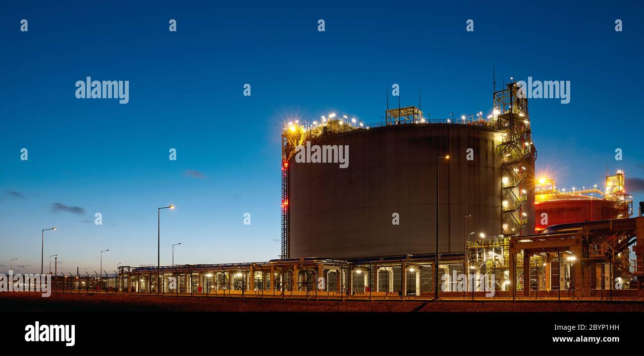 Liquefied natural gas (LNG) storage tank installation at dusk Stock ...