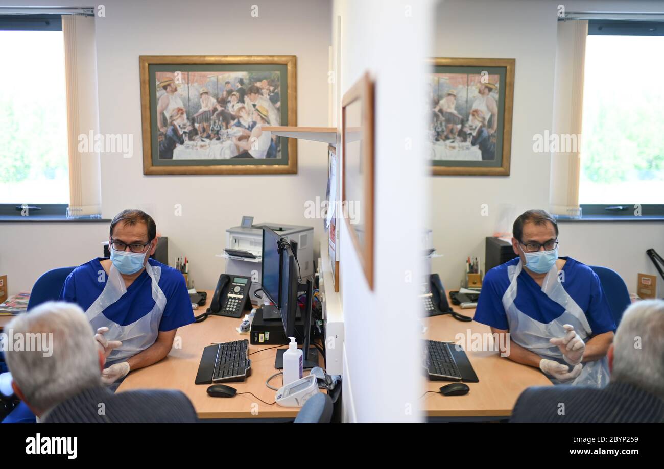 Doctor Khurram Jafri wears personal protective equipment (PPE) as he ...