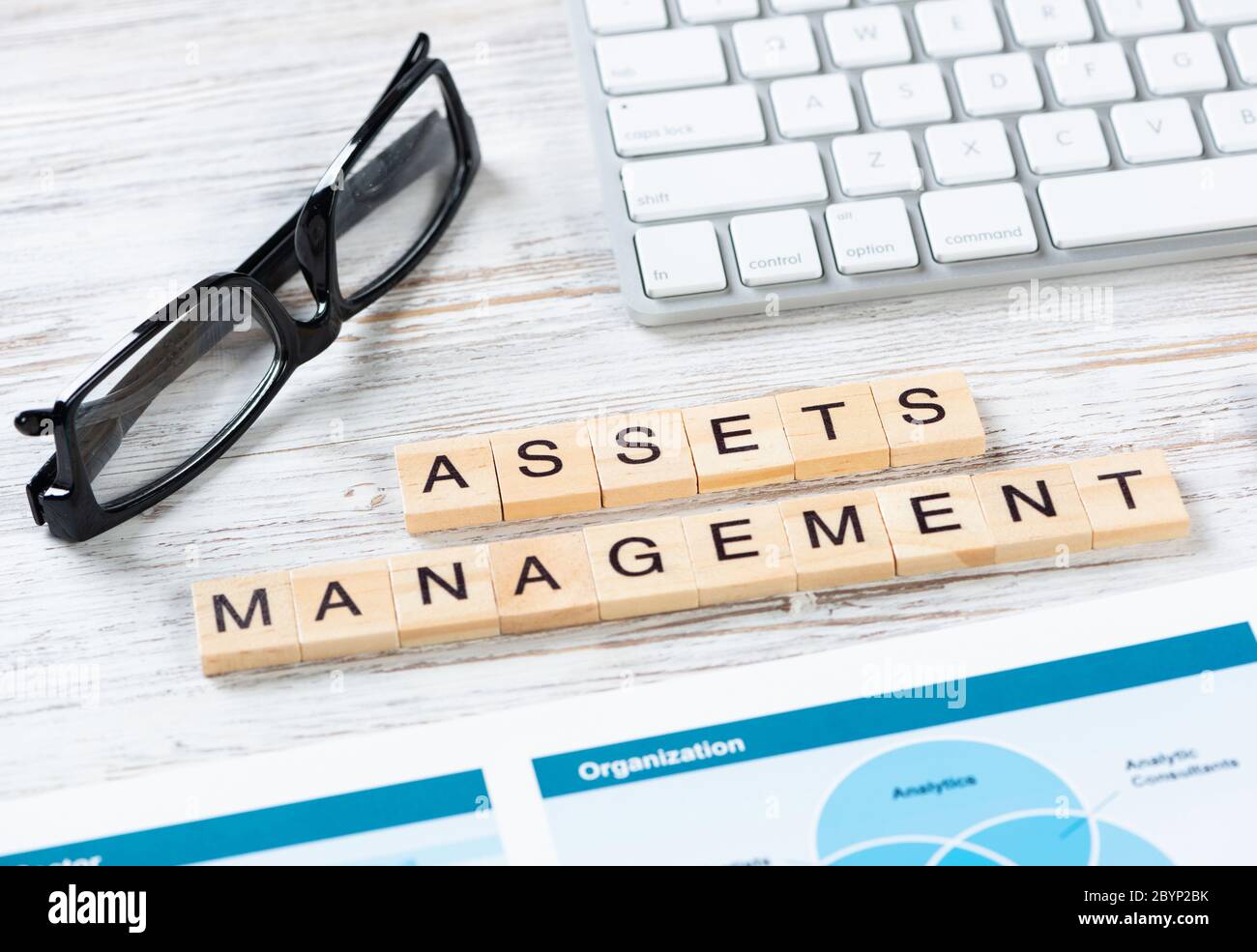 Asset management concept with letters on cubes Stock Photo - Alamy