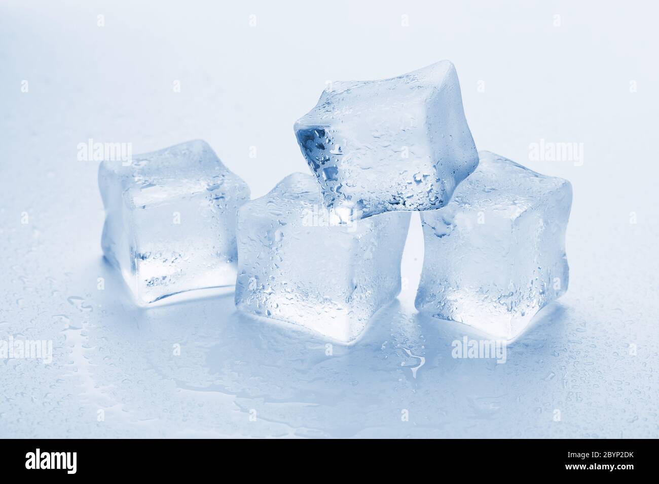 Melted ice cubes close up isolated on white background Stock Photo - Alamy
