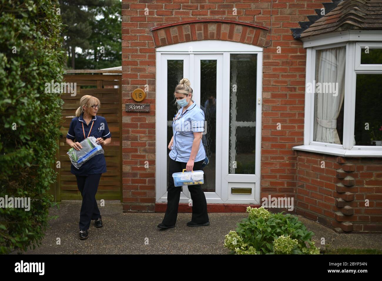 District nurses Rebecca McKenzie (right) and Emma Fiello leave the ...