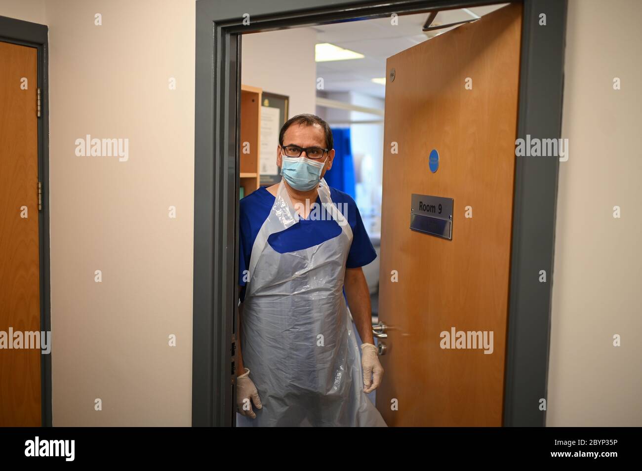 Doctor Khurram Jafri wears personal protective equipment (PPE) as he ...