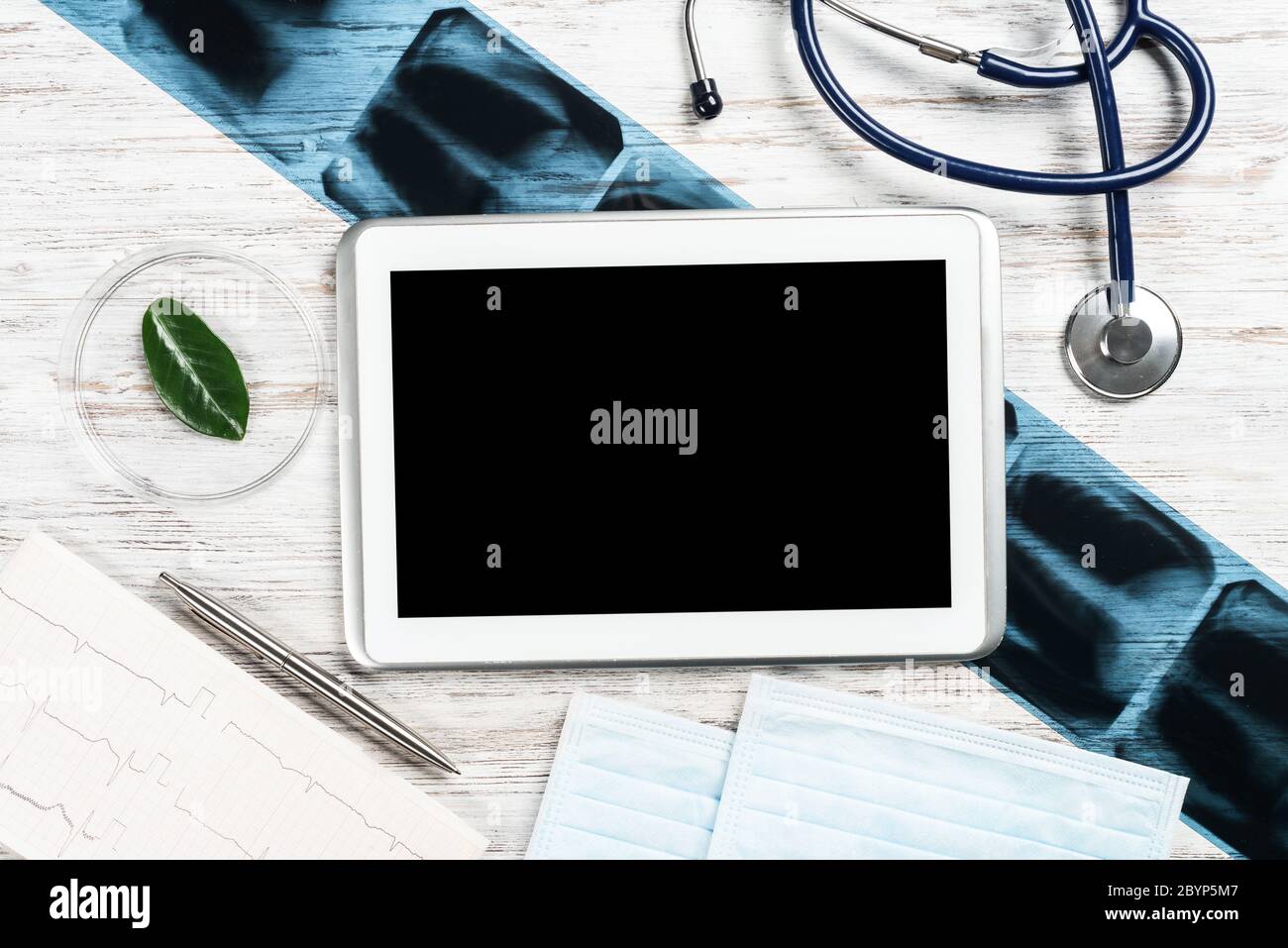Mock up of doctors desktop with medical supplies Stock Photo - Alamy