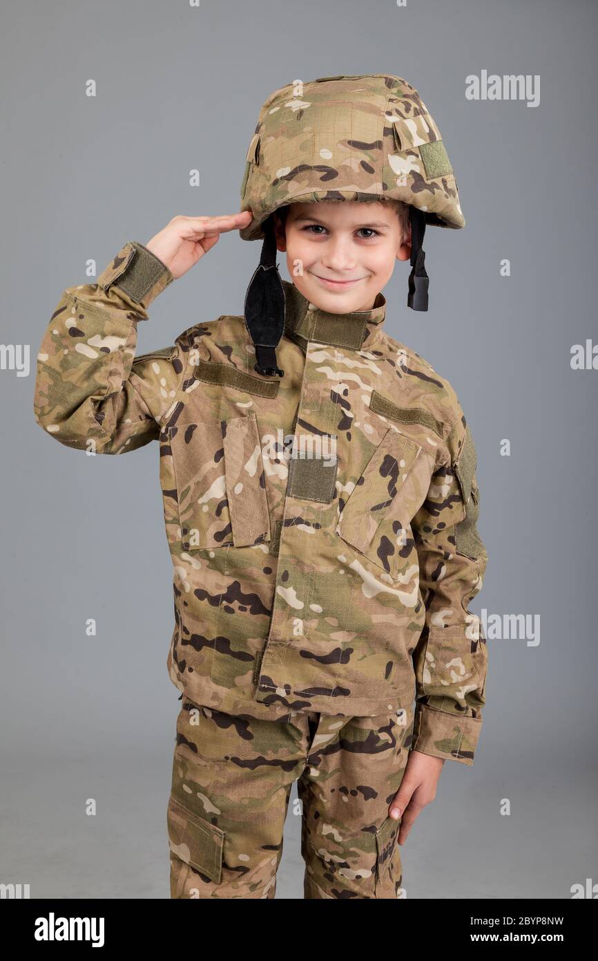Saluting soldier. Young boy dressed like a soldier Stock Photo - Alamy