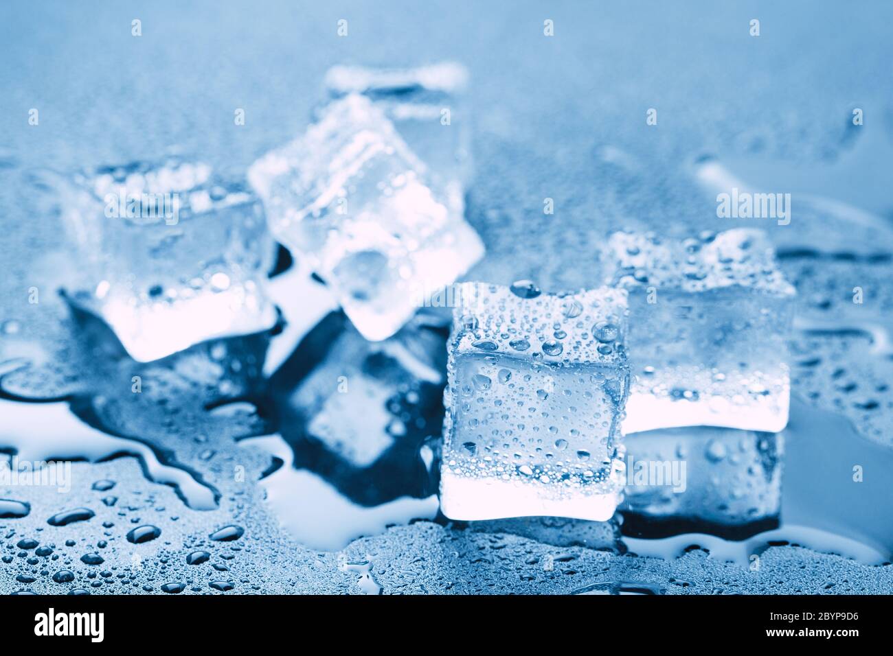 Ice cubes square with drops water clean on blue background Stock Photo ...
