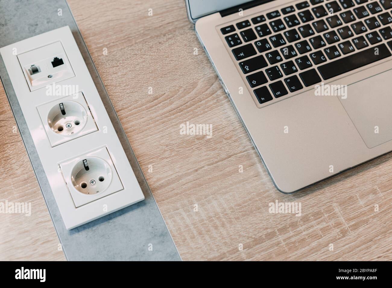 modern white plastic sockets in an office room Stock Photo - Alamy