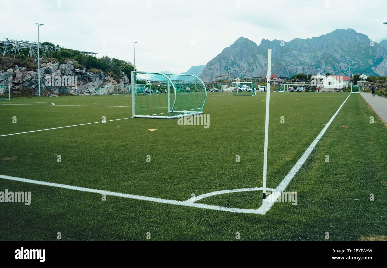 Artificial green grass with white stripe of soccer field. White line on ...