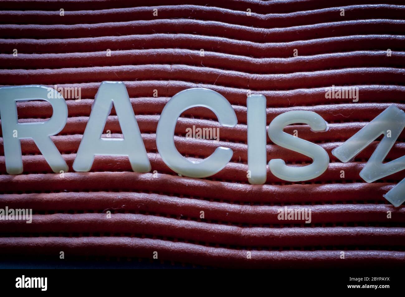 Racism - word from letters, the belief of inequality of human races ...