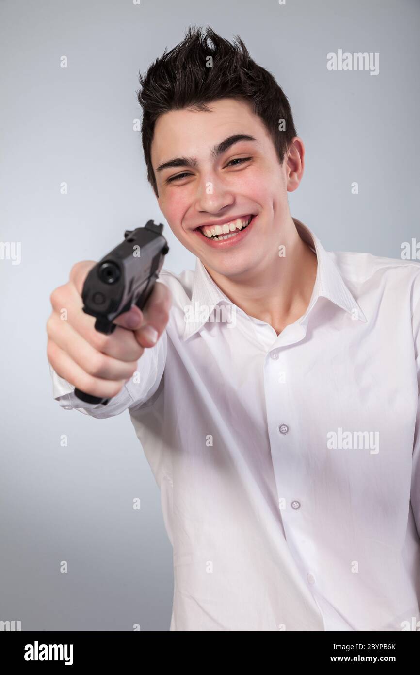 Aiming. Serious man with a gun Stock Photo - Alamy