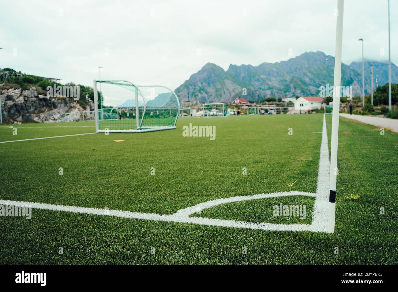 Artificial green grass with white stripe of soccer field. White line on ...