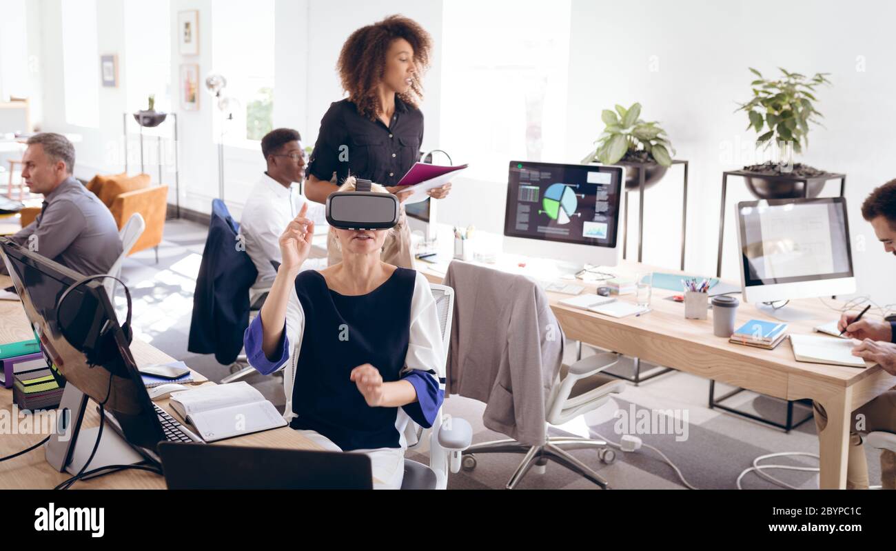 Multi races group working together Stock Photo - Alamy