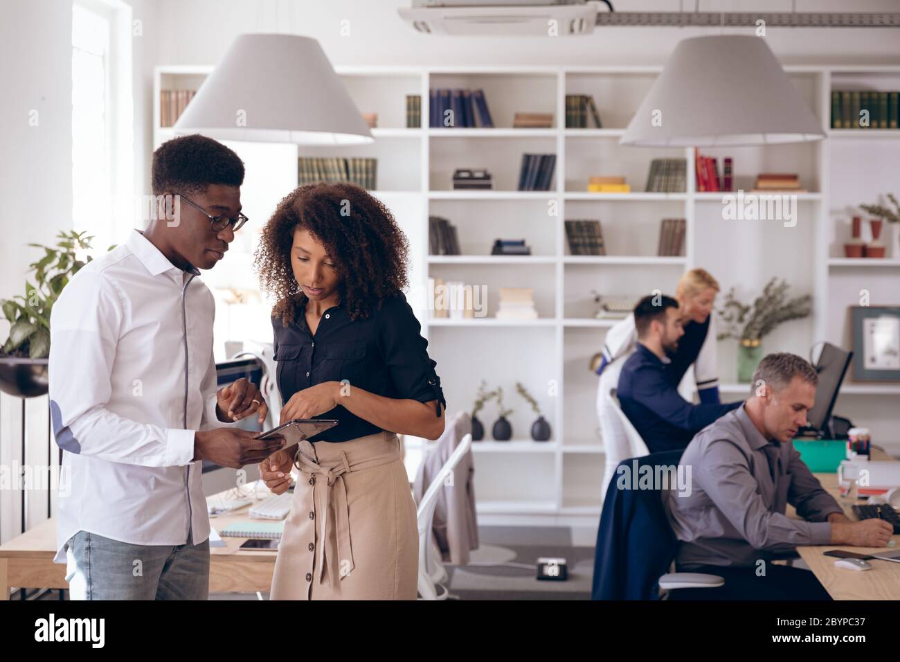 Multi races businesspeople working together Stock Photo - Alamy
