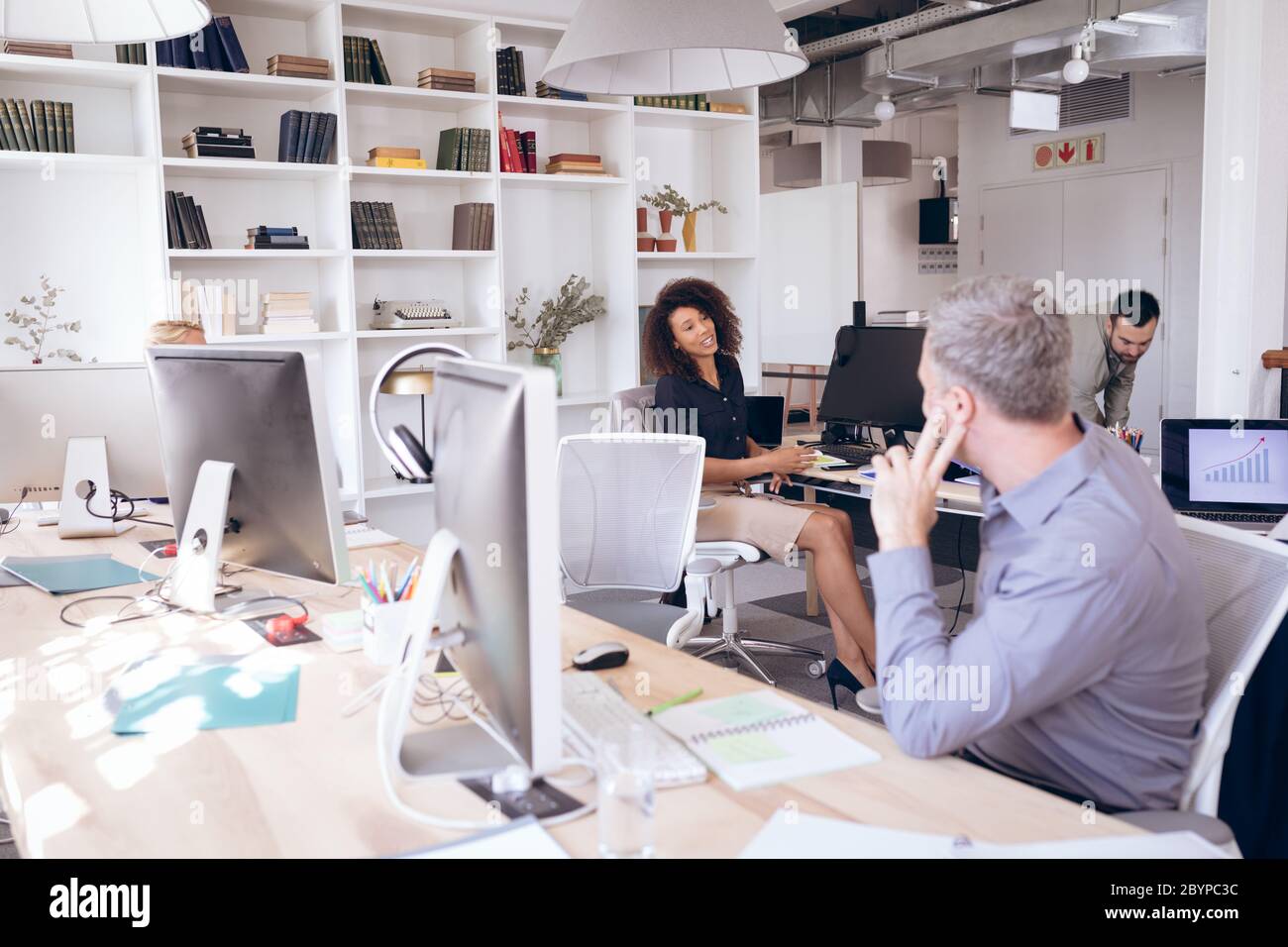 Happy multi races businesspeople working together Stock Photo - Alamy